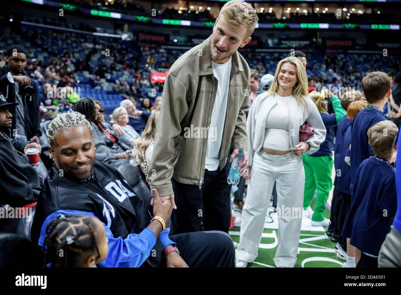 New Orleans Saints quarterback Tyler Shough, center, greets Saints ...