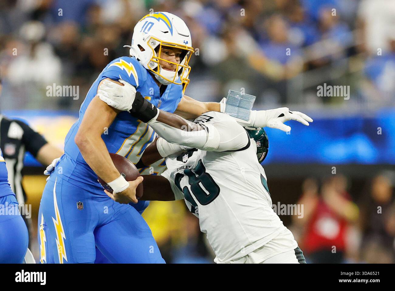 Los Angeles Chargers quarterback Justin Herbert (10) is tackled by ...