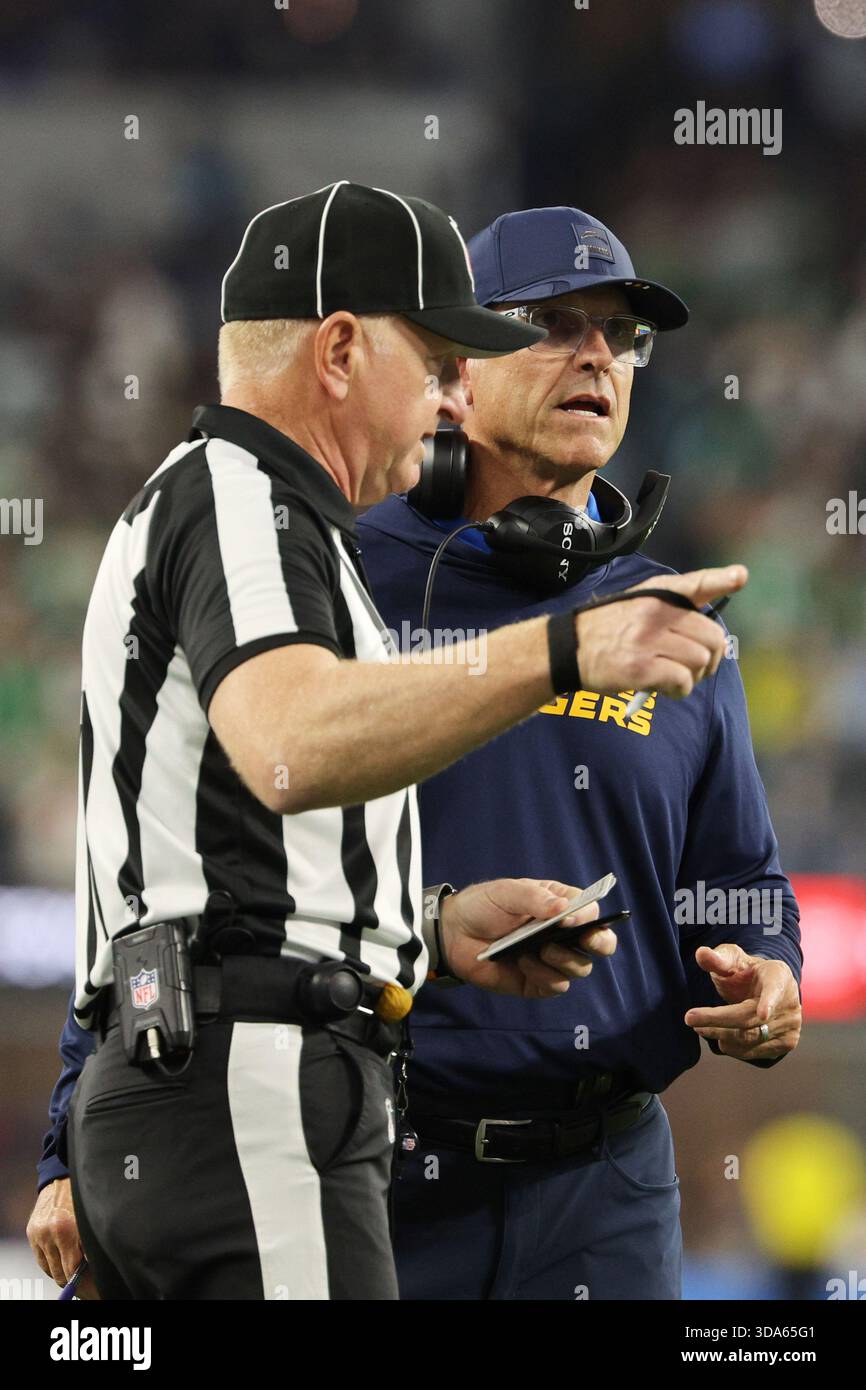 Los Angeles Chargers head coach Jim Harbaugh talks to a referee during ...