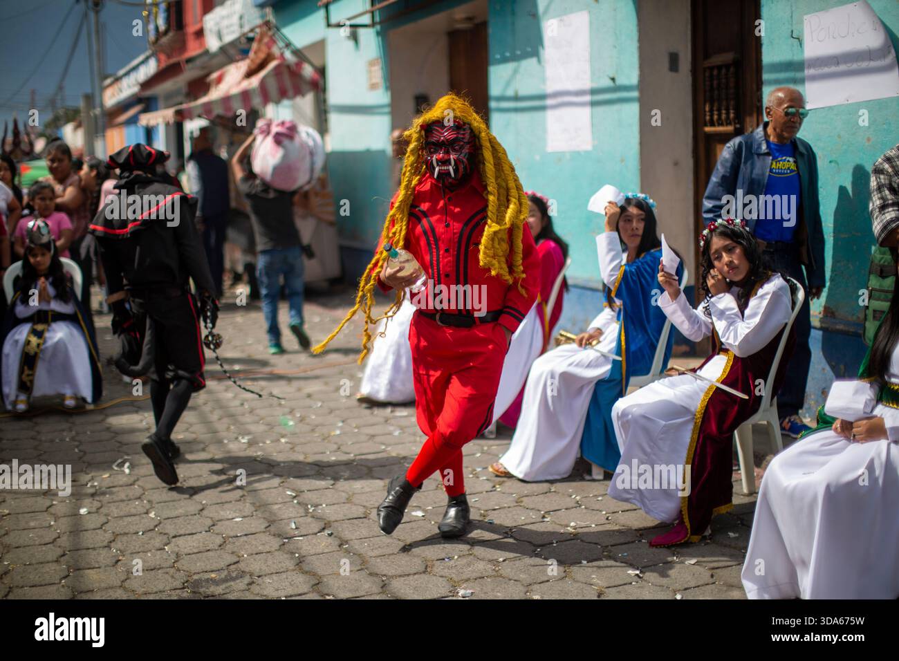 A man dressed as a devil dances during the celebration of the Dance of ...