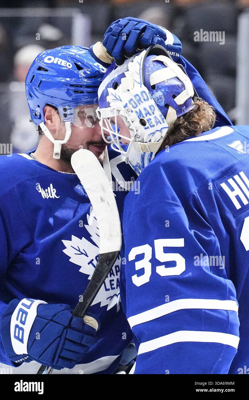 Toronto Maple Leafs' Auston Matthews (34) congratulates teammate Dennis ...