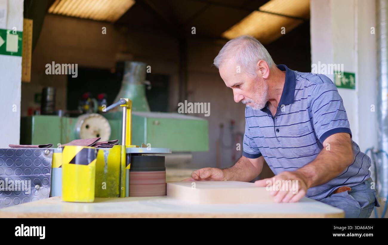 Elderly male carpenter sanding hi-res stock photography and images - Alamy