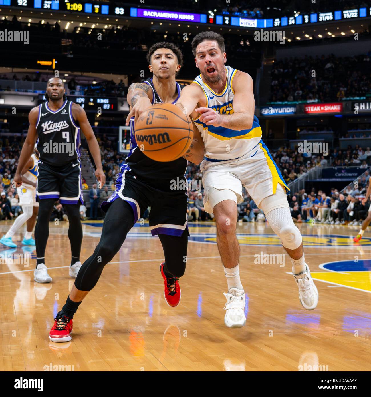 Sacramento Kings guard Nique Clifford, left, and Indiana Pacers guard T ...