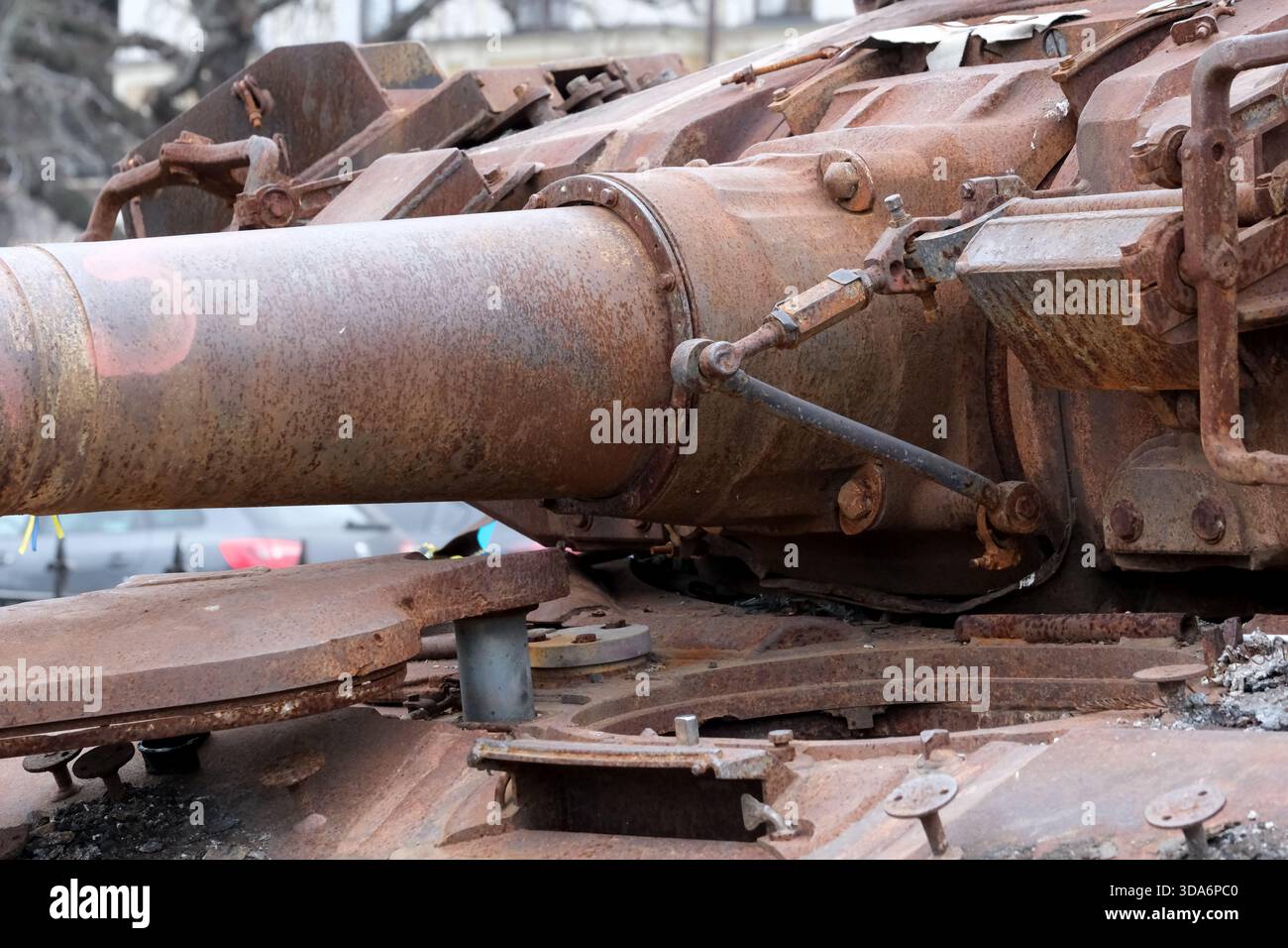 An old and rusting tank stands still in a city, showcasing its battle ...