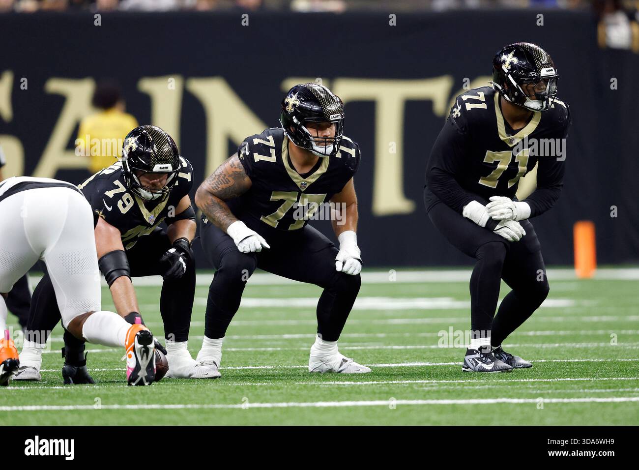 New Orleans Saints offensive tackle Dillon Radunz (77) lines up during ...