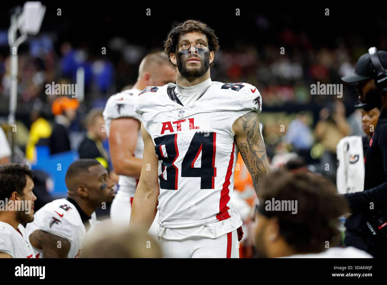 Atlanta Falcons tight end Feleipe Franks (84) watches from the sideline ...