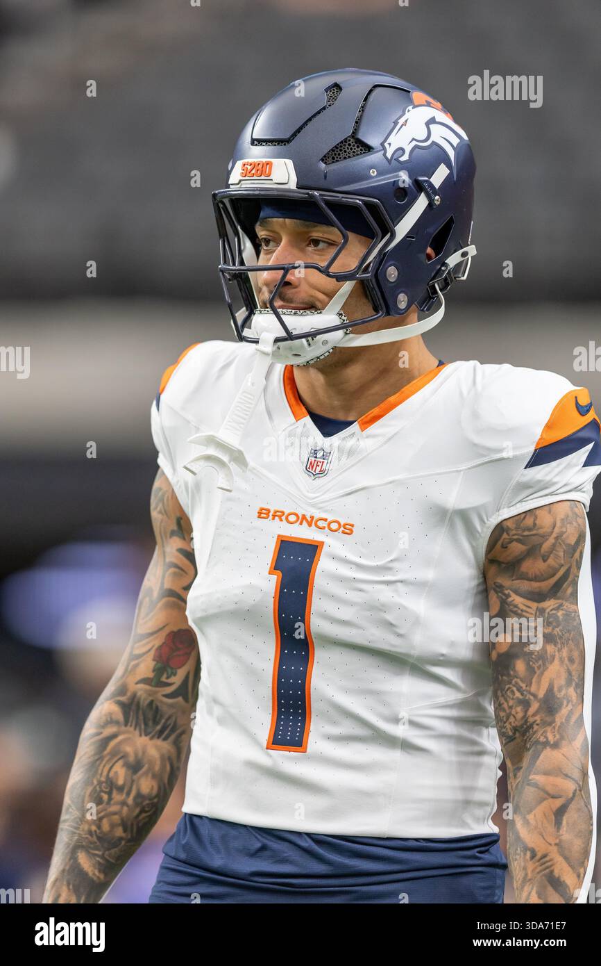 Denver Broncos tight end Evan Engram (1) warms up before playing ...
