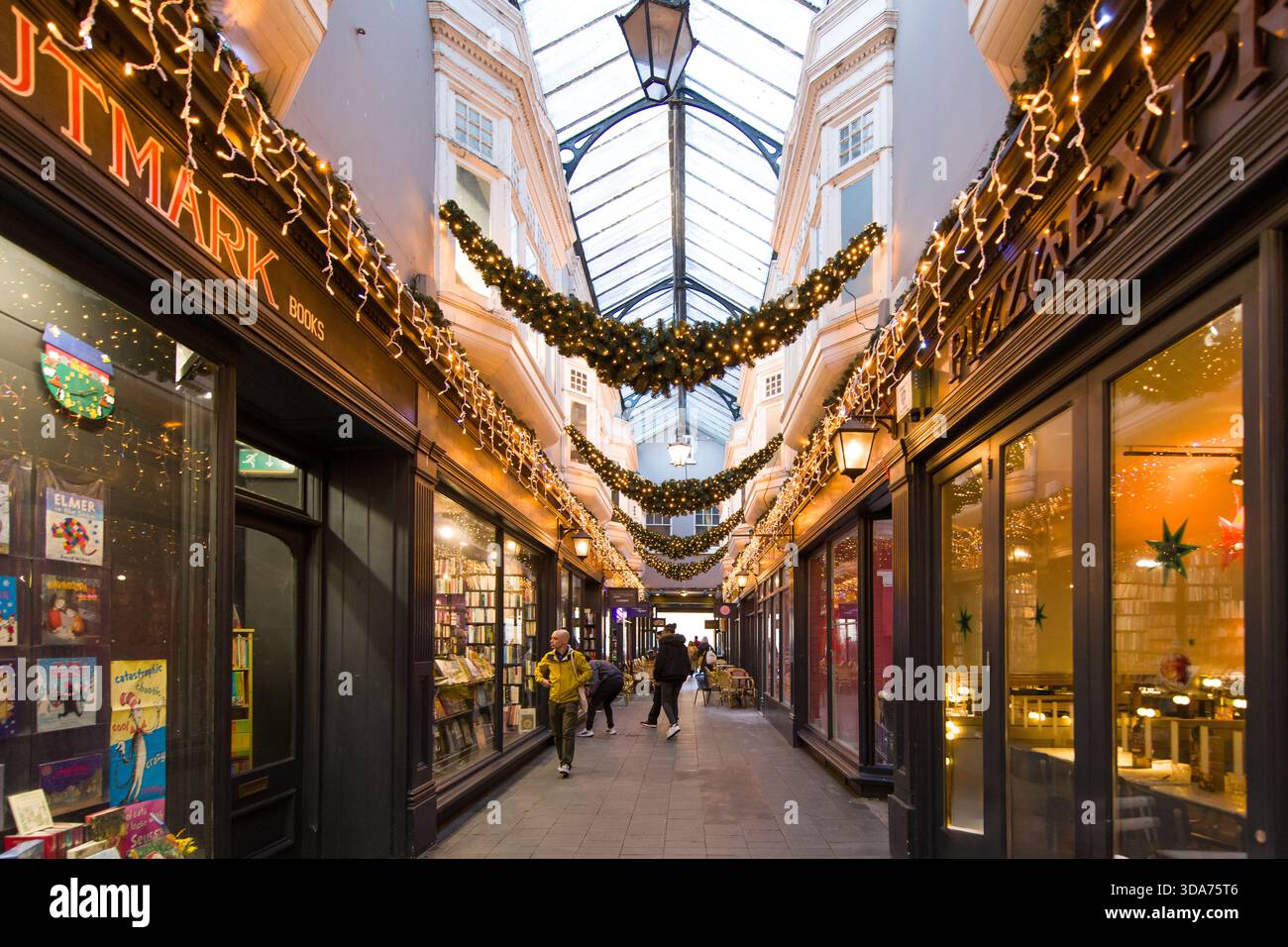 Christmas decorations inside Castle Arcade with bookshop storefronts ...