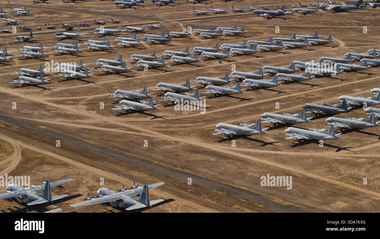 Aerial view of rows of retired aircraft baking under the desert sun at ...