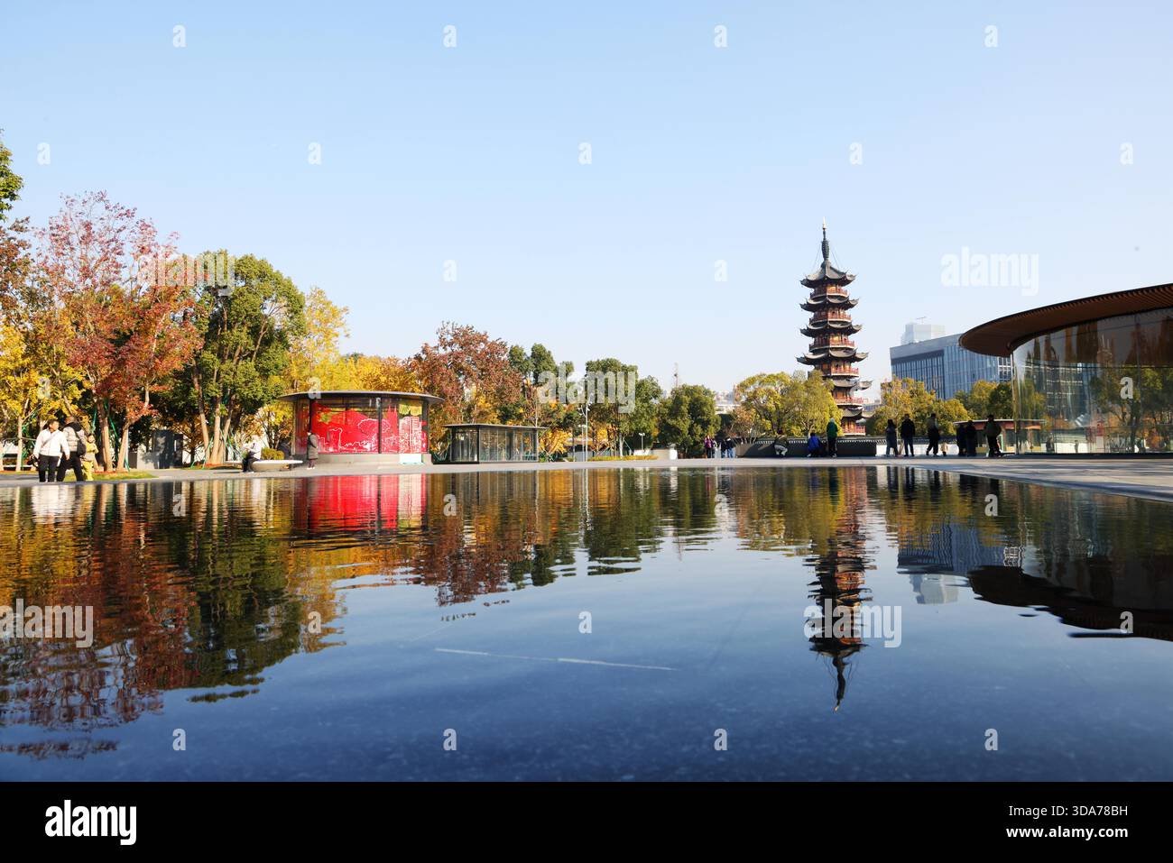 Tourists admire ginkgo trees at Longhua Temple in Shanghai, China, 6 ...
