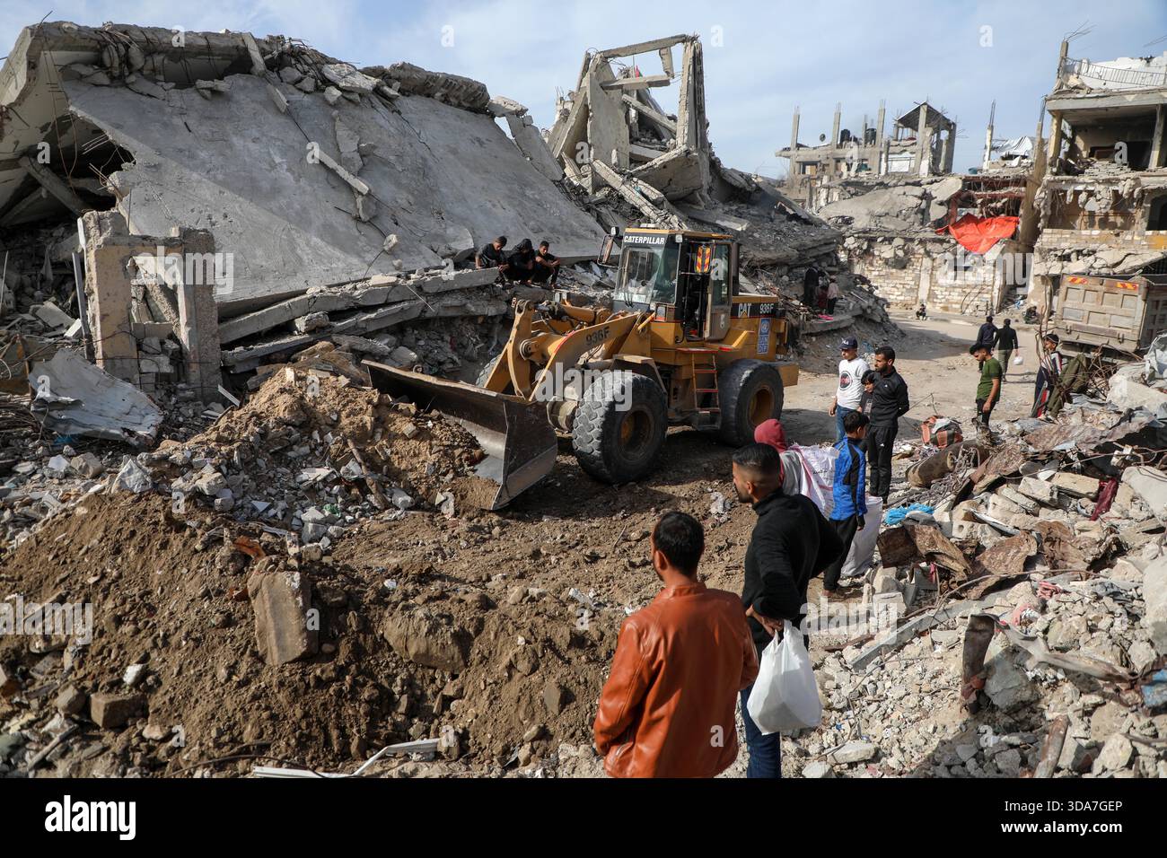 (251209) -- GAZA, Dec. 9, 2025 (Xinhua) -- A bulldozer removes the debris of homes destroyed in ...