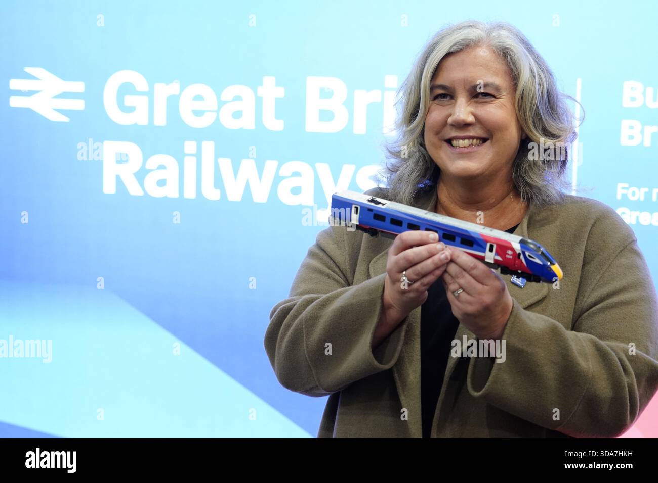 Transport Secretary Heidi Alexander holds a model train decorated with ...