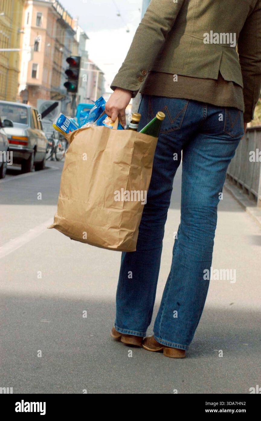 handing over a paper bag for transporting goods at the market paper bag ...