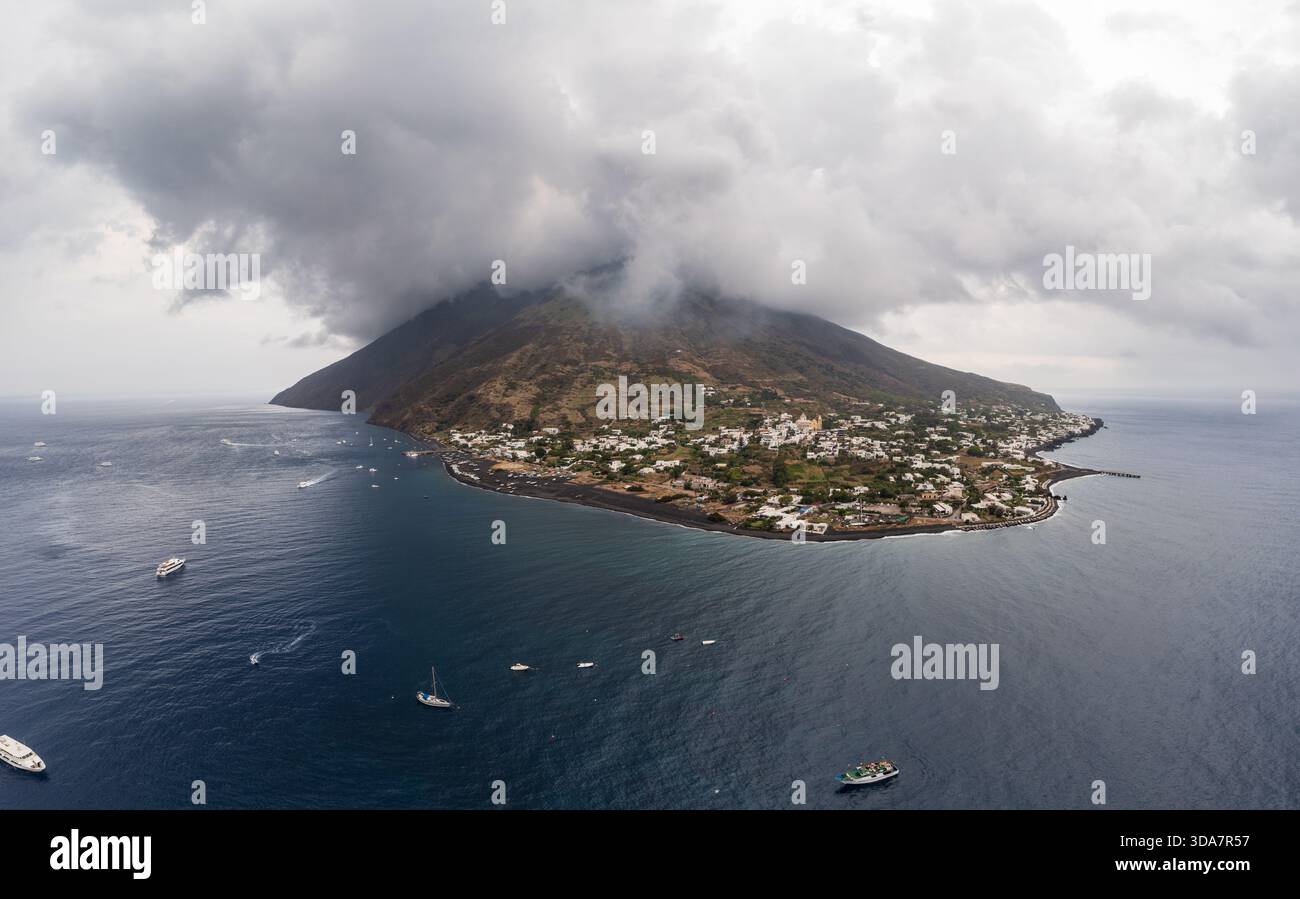 Aerial view of the volcanic island dominated by Stromboli, where dark ...