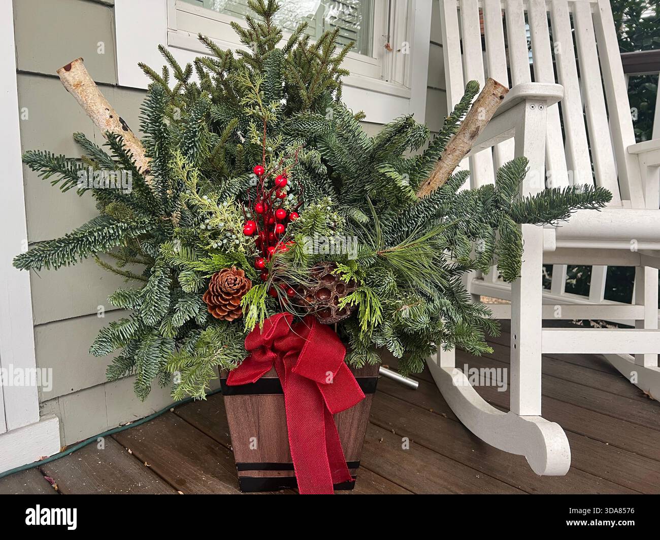 A holiday arrangement of greenery is displayed at a home on Long Island ...