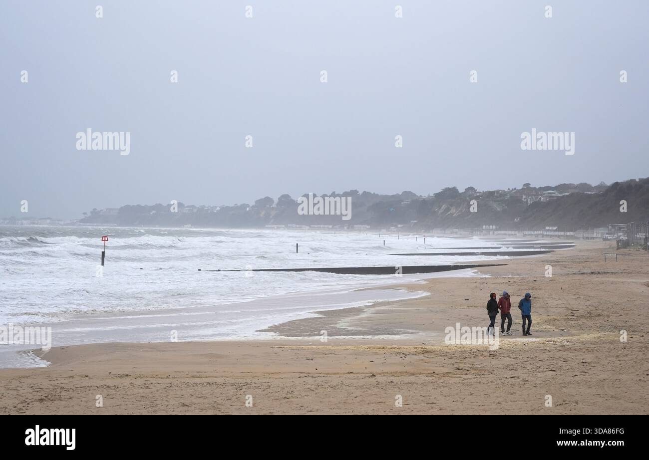People walk along Bournemouth beach in Dorset. The Met Office has ...