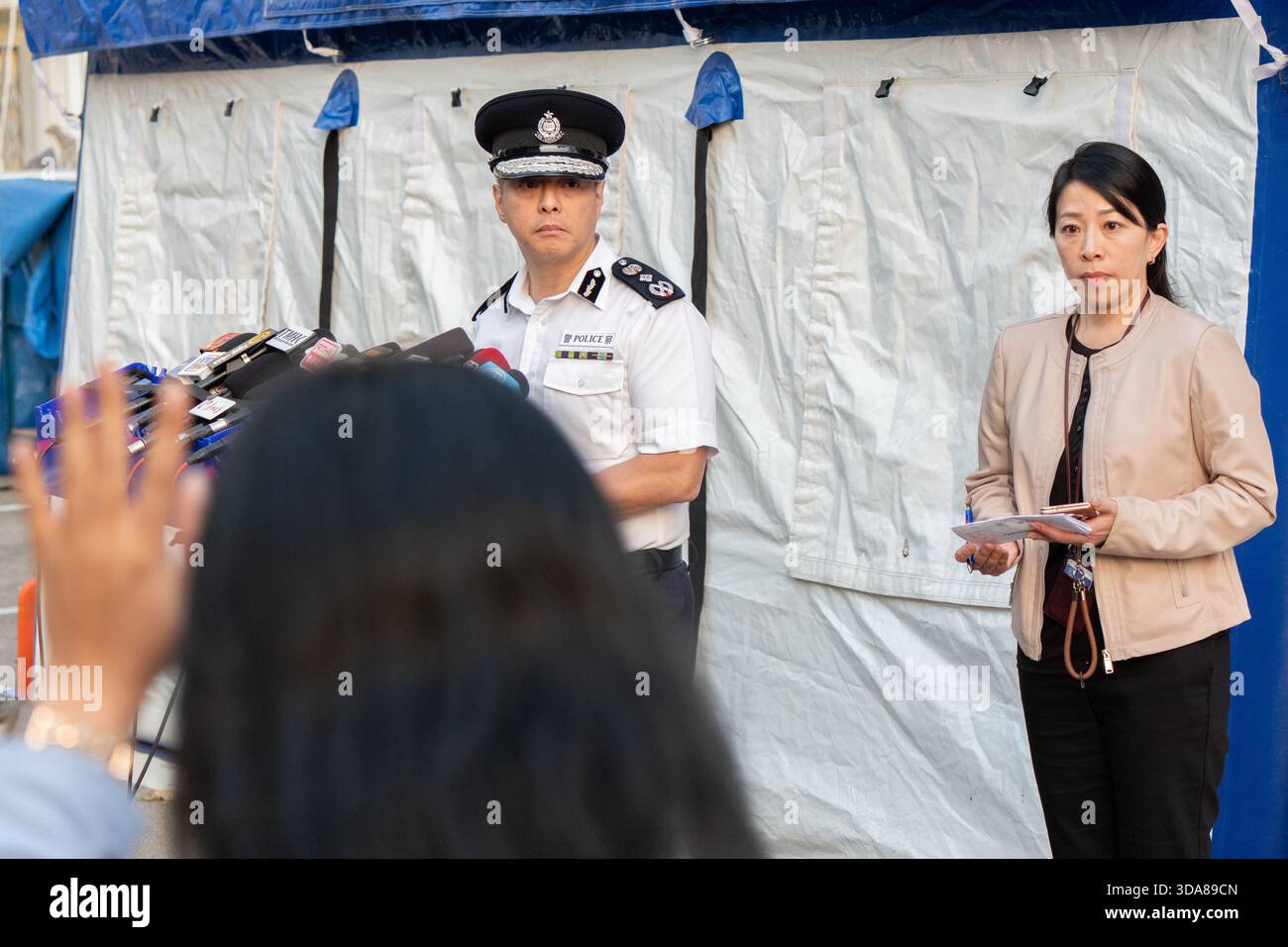 Joe Chow Yat-ming (L), Commissioner of Police and Tsang Shuk-yin (R), Chief Superintendent of ...