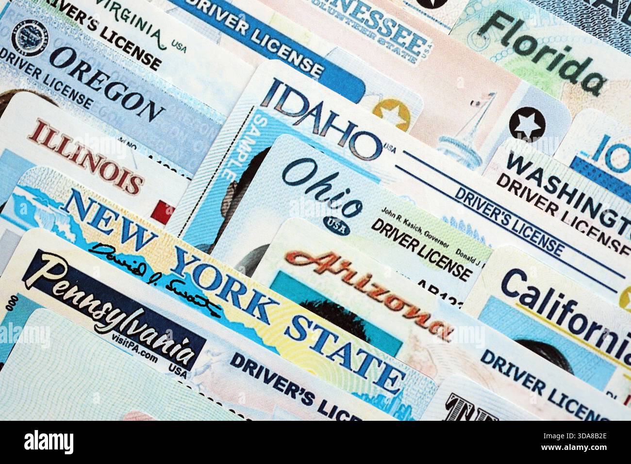 Big amount of driving licenses from different USA states. Stack of ...