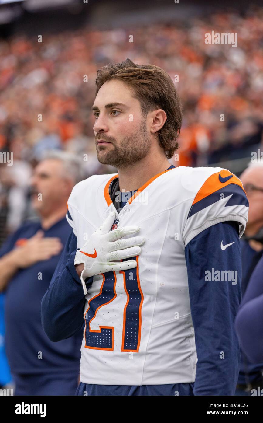 Denver Broncos cornerback Riley Moss (21) stands for the national ...
