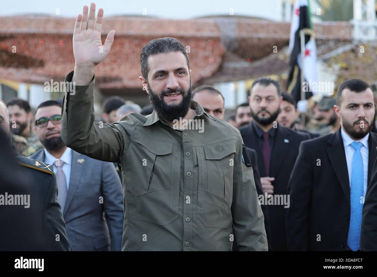 Syrian President Ahmad al Sharaa, wearing military uniform, attends a ...