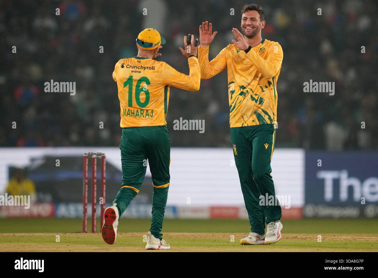 South Africa's Donovan Ferreira, right, celebrates the wicket of India ...