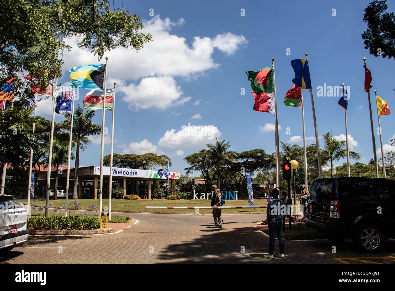 Delegates walk past UN member state flags during the United Nations ...