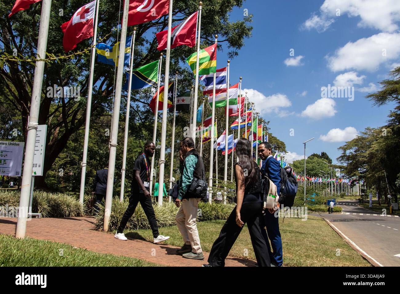 Delegates walk past UN member state flags during the United Nations ...