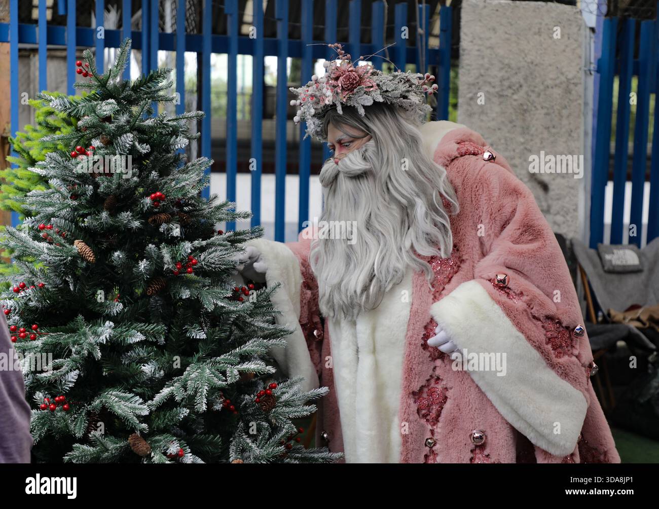 The artist José Miguel Moctezuma, known as Santa Iluminado, making a ...