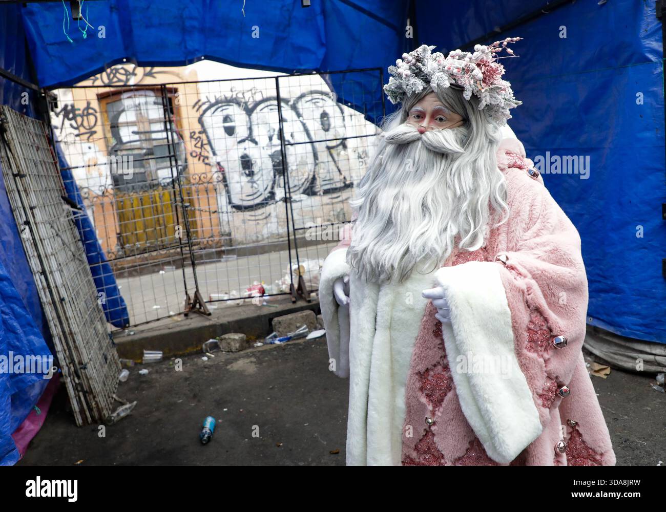 The artist José Miguel Moctezuma, known as Santa Iluminado, making a ...