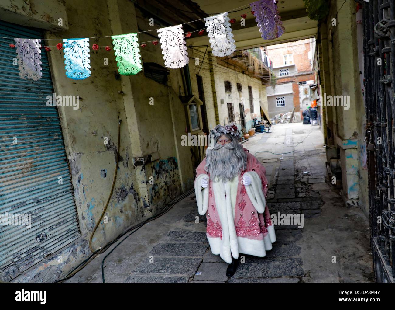 The artist José Miguel Moctezuma, known as Santa Iluminado, making a ...