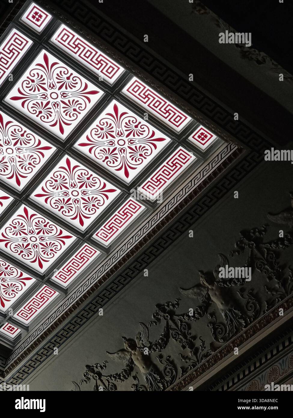 Detail of skylight in an old house. Coffered glass panels with greek ...