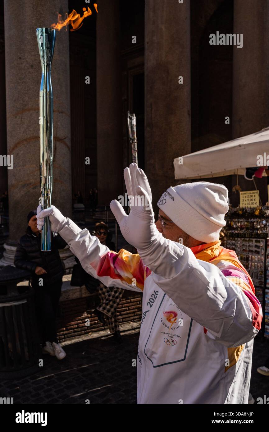 Rome, Italy - December 8, 2025: Winter Olympic torch relay runner ...