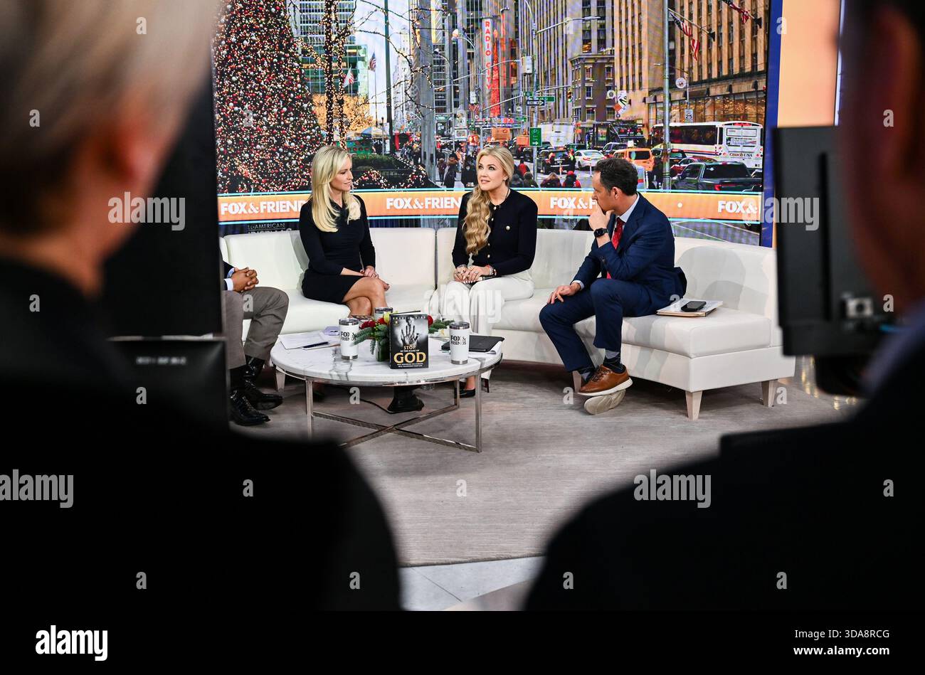 Turning Point USA CEO Erika Kirk, center, speaks during an appearance ...