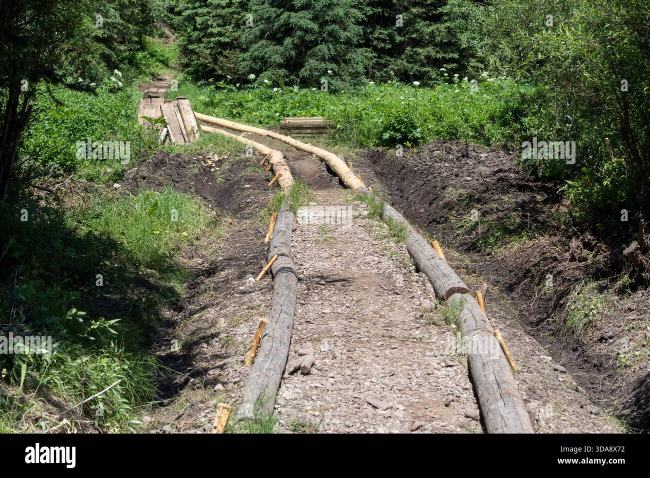 Turnpike trail under construction in a wetland along the Middle Fork of ...