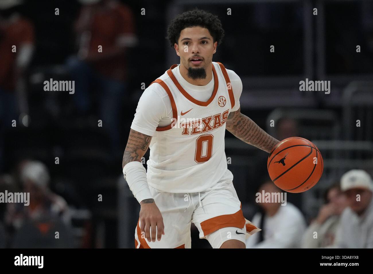 Texas guard Jordan Pope (0) during an NCAA college basketball game ...