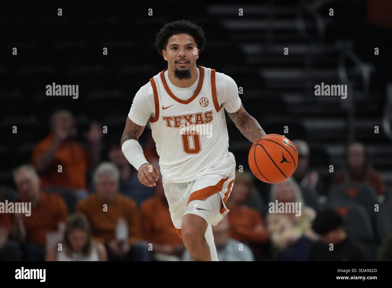 Texas guard Jordan Pope (0) during an NCAA college basketball game ...