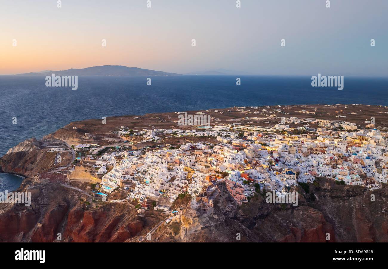 Aerial view of the charming, sun-kissed village cascading down rugged ...