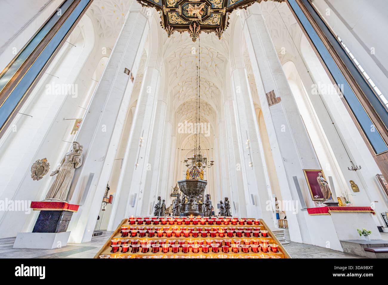 Interior of St. Mary’s Church with nave, altar, and vaulted ceilings in ...