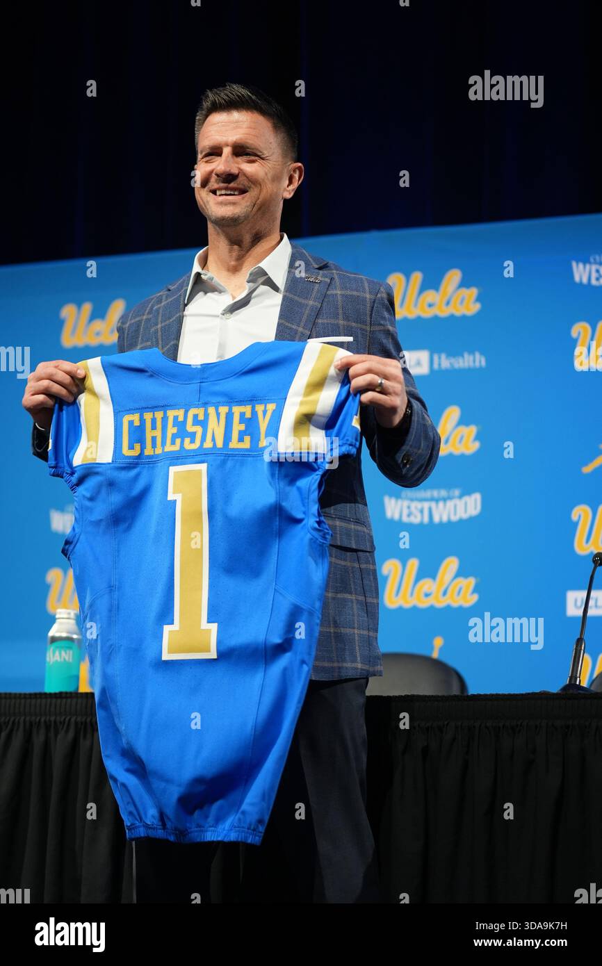 Bob Chesney holds a jersey during his introduction as the new head ...