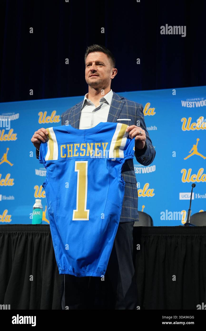 Bob Chesney holds a jersey during his introduction as the new head ...