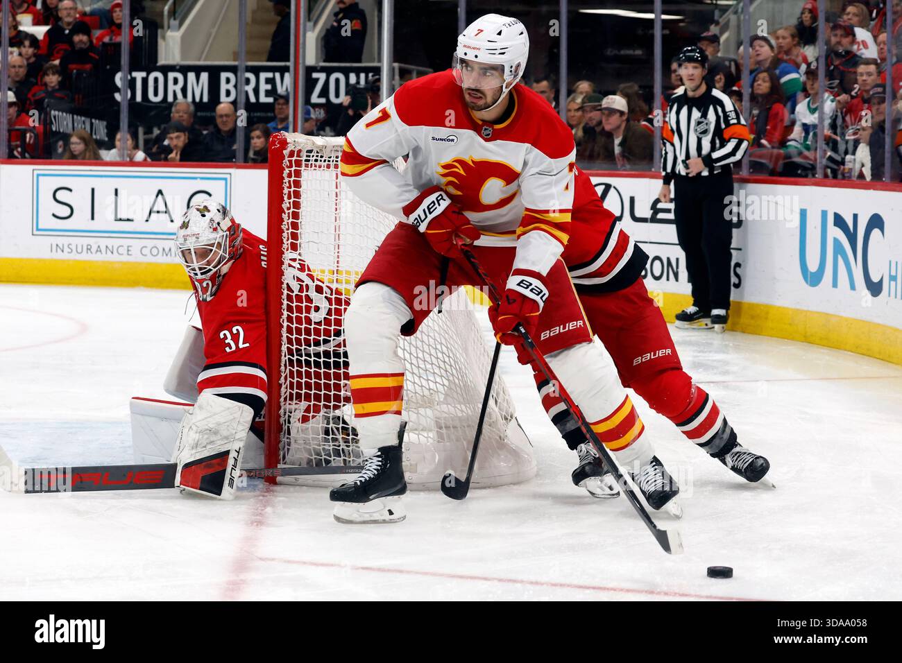 Calgary Flames' Kevin Bahl (7) controls the puck near Carolina ...