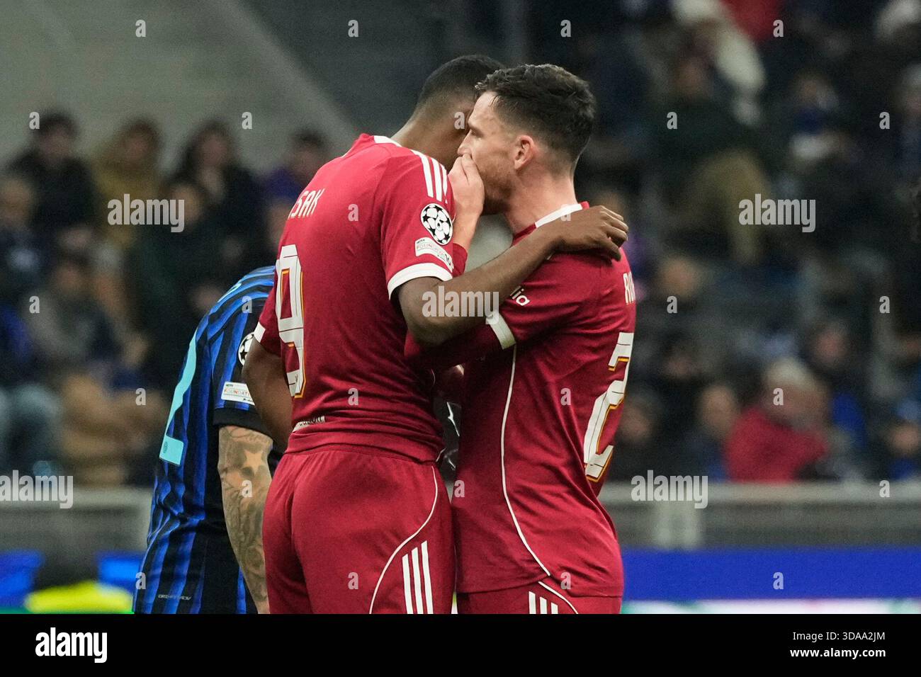 Liverpool's Alexander Isak, left, speaks to Liverpool's Andrew ...