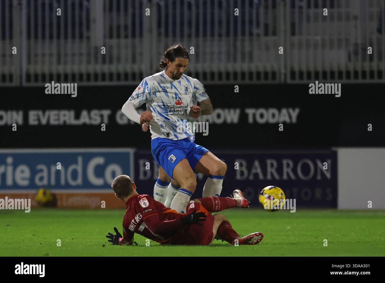 Tranmere Rovers' Charlie Whitaker tackles Barrow's Jordan Williams ...