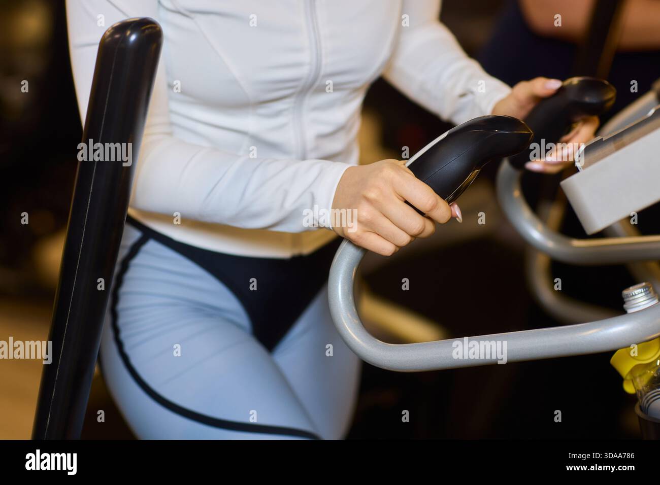 Woman intensely focused during cardio hi-res stock photography and ...