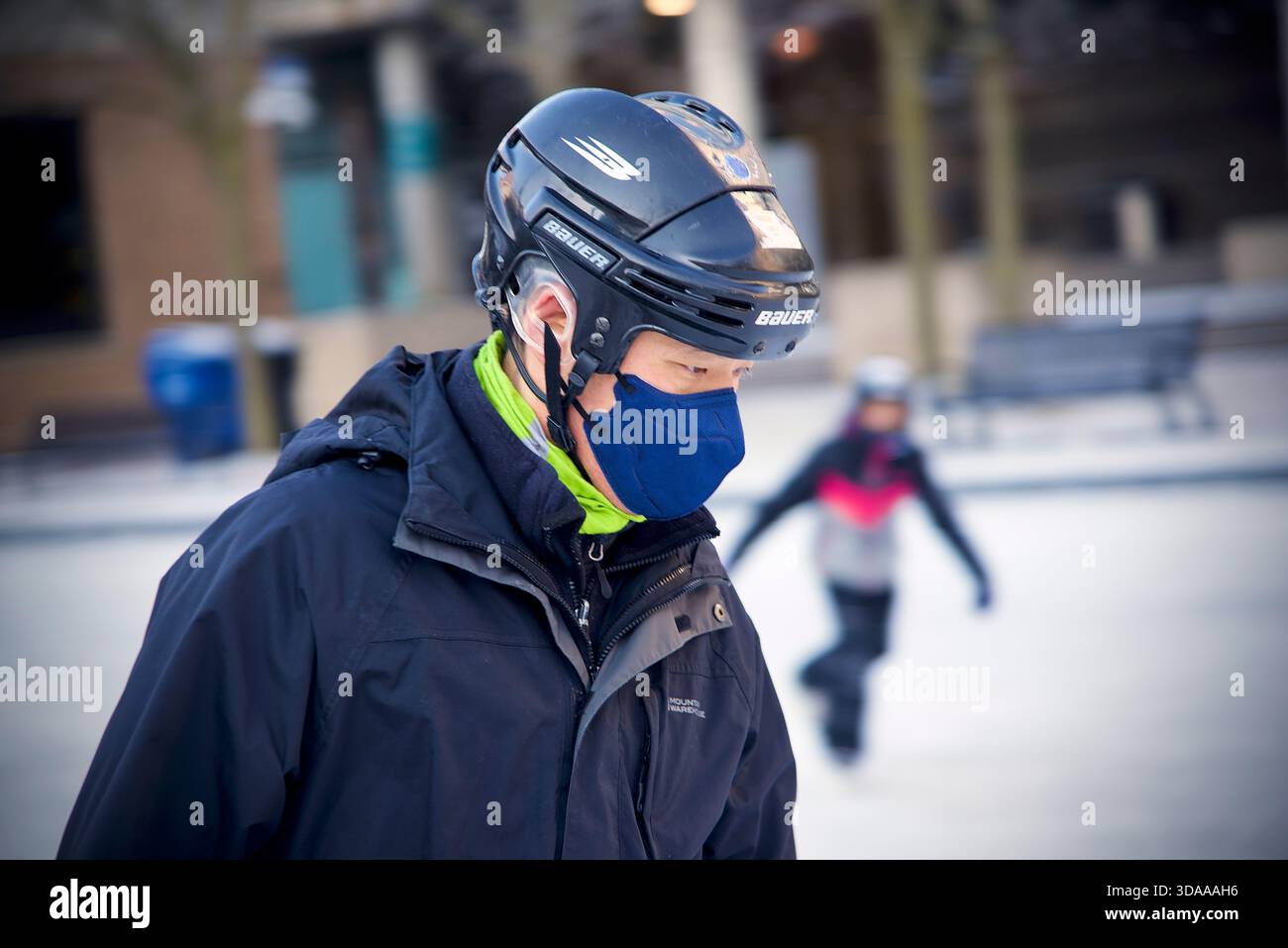 Asian wearing masks while ice skating at Mel Lastman Square Stock Photo ...