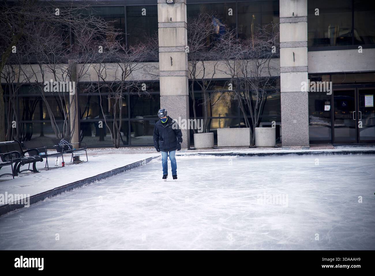 People wearing masks while ice skating at Mel Lastman Square Stock ...