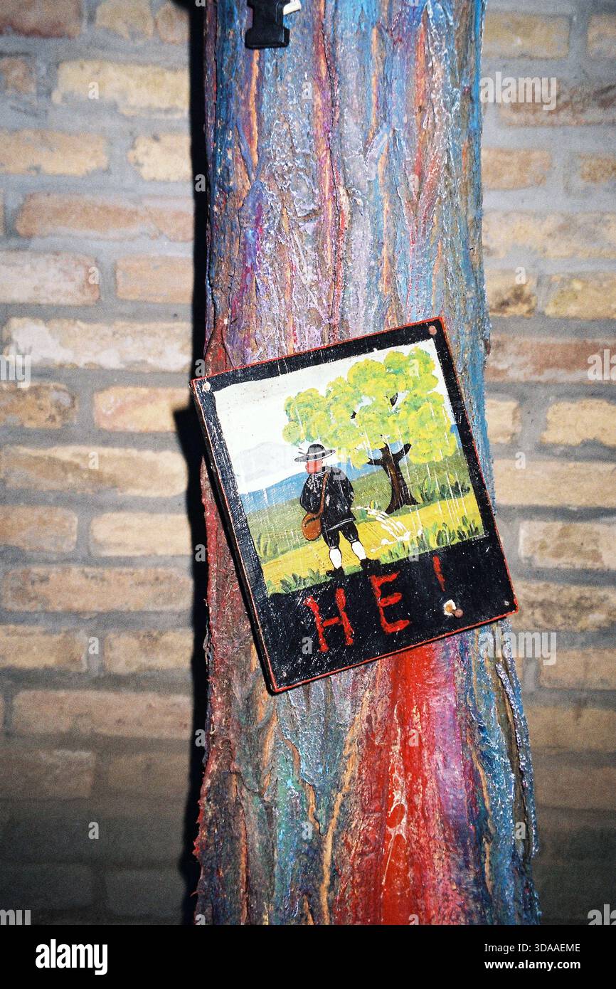 Analog flash shot of a tree painted in psychedelic colors with a ...