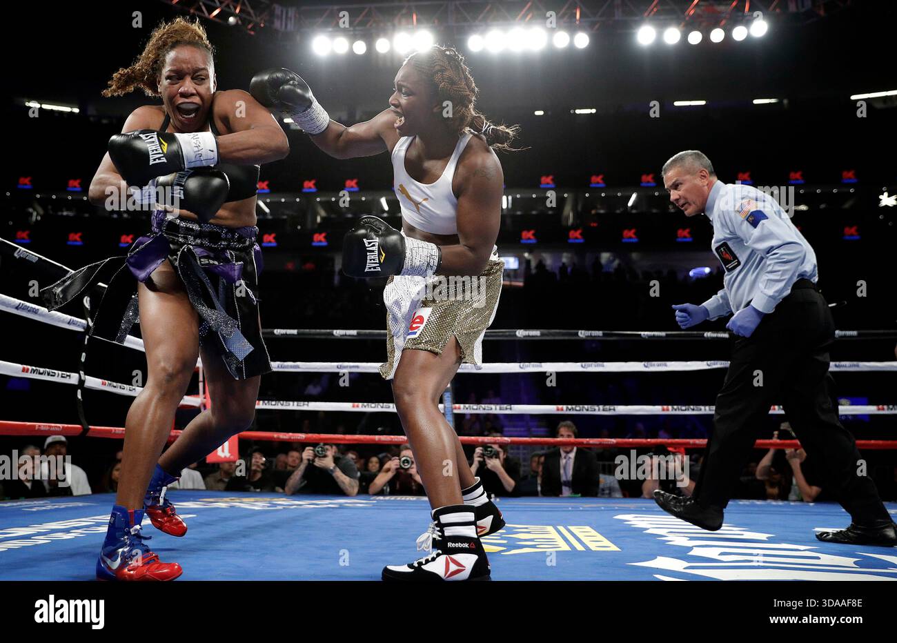 FILE- Franchon Crews, left, follows through on a punch to Claressa ...