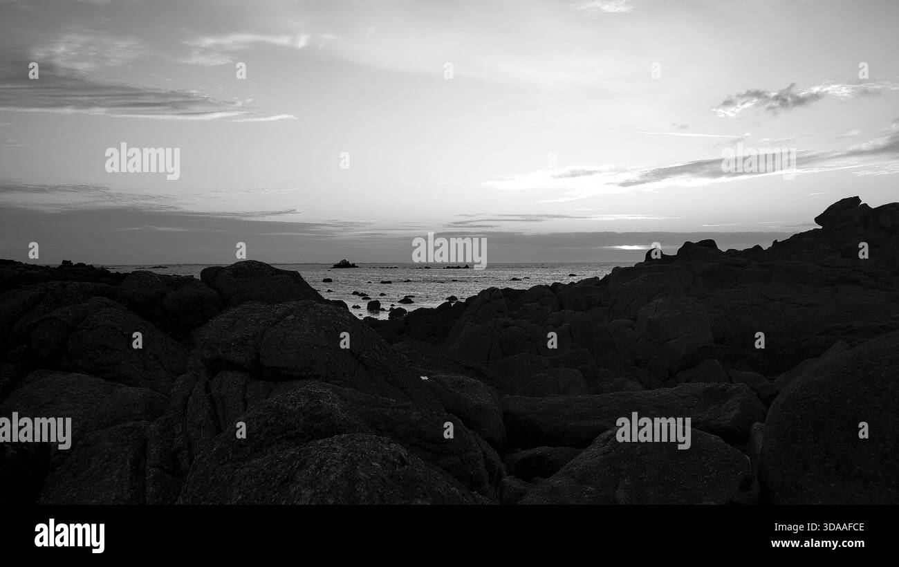 Rocky shore at sunset Black and White Stock Photos & Images - Alamy