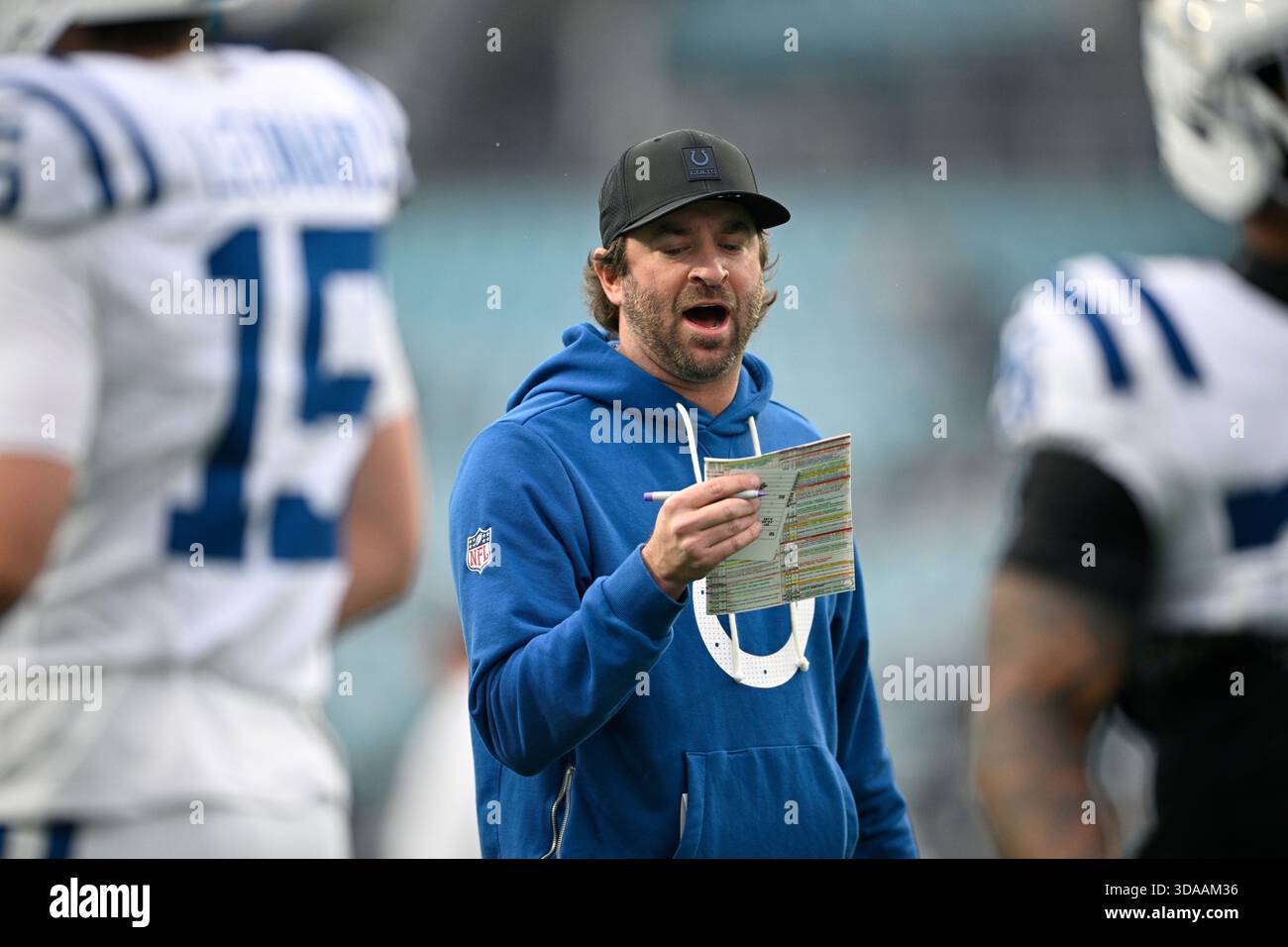 Indianapolis Colts quarterbacks coach Cam Turner, center, calls out ...